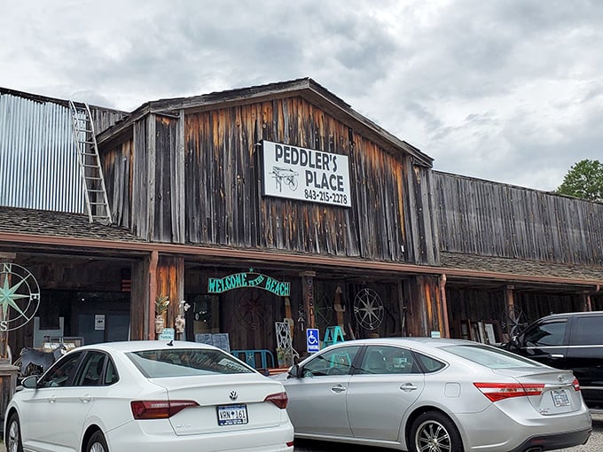The weathered wooden facade of Peddler's Place isn't just rustic charm—it's a warning sign that your wallet is about to experience a joyful lightening.