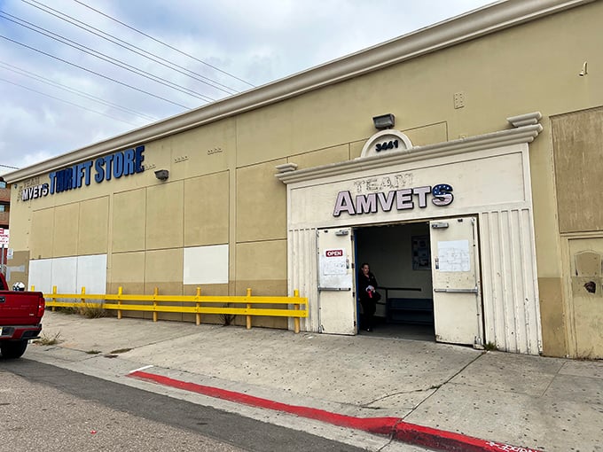 The unassuming exterior of Team Amvets Thrift Store in San Diego – where treasure hunting begins beneath that iconic red and blue signage.