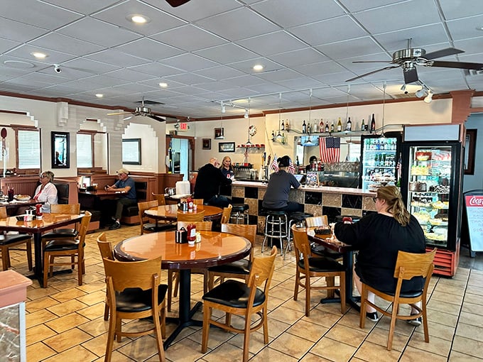 The stone facade of Sandy Springs Diner stands like a culinary fortress, promising comfort food treasures within those burgundy-awninged walls.