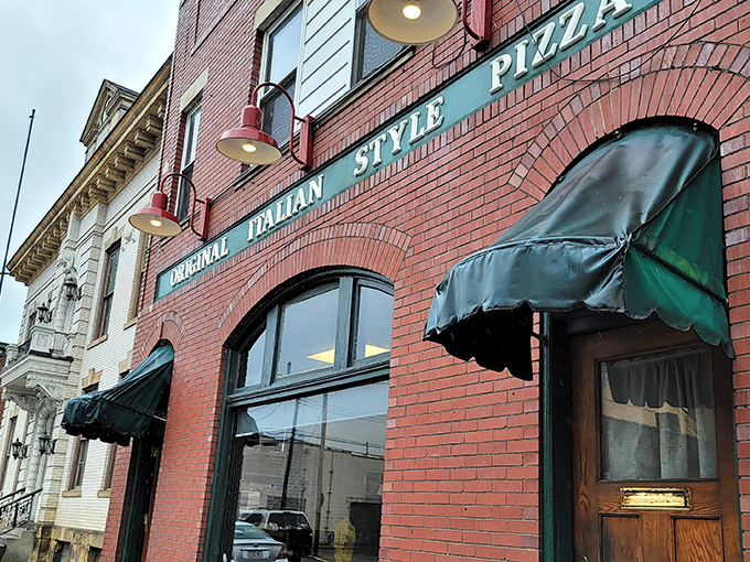 The iconic brick facade of Police Station Pizza stands as a testament to pizza history in Ambridge – simplicity and tradition in architectural form.