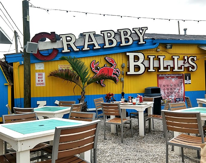 The cheerful yellow and blue exterior of Crabby Bill's stands out like a beacon of seafood hope on Indian Rocks Beach, promising fresh catches and Florida charm.