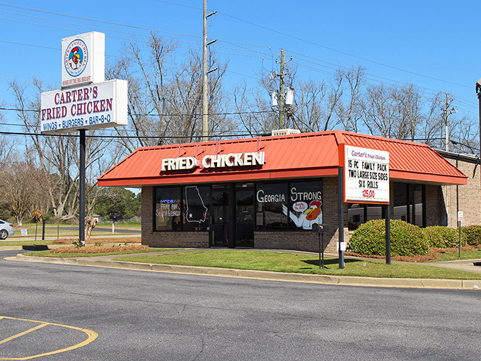 The iconic red roof of Carter's Fried Chicken stands like a beacon of hope for hungry travelers. Southern comfort food paradise awaits inside!