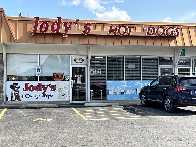 That storefront sign isn't whispering sweet nothings – it's shouting "hot dog heaven" to anyone with taste buds.