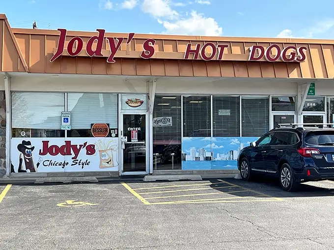 That storefront sign isn't whispering sweet nothings – it's shouting "hot dog heaven" to anyone with taste buds.