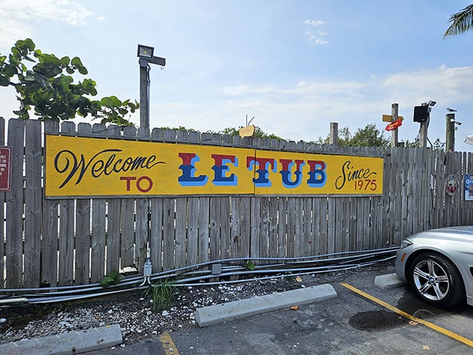 That weathered yellow sign isn't just welcoming you—it's practically begging you to discover Florida's best-kept seafood secret.