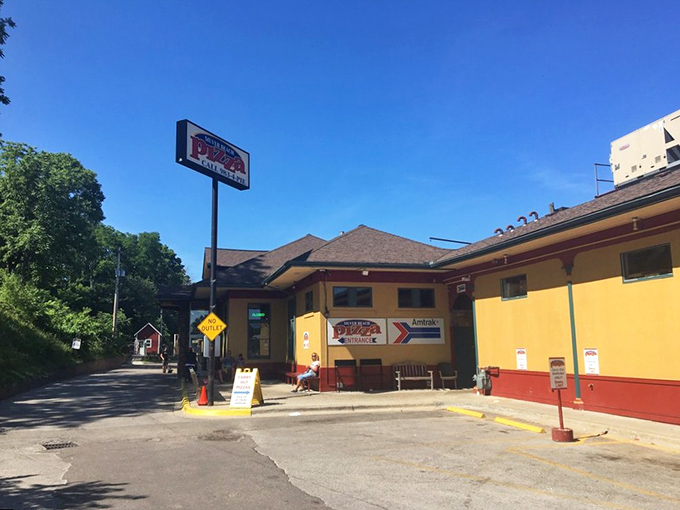 The yellow and burgundy exterior of this converted train depot promises something special inside. All aboard for flavor town!