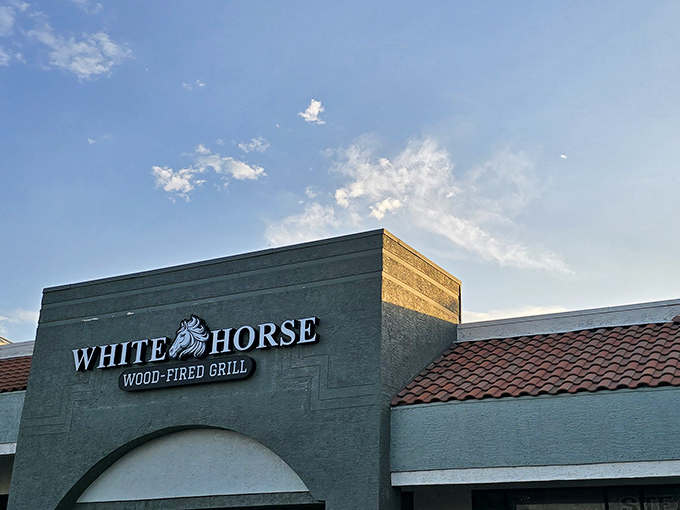 The unassuming exterior of White Horse Wood-Fired Grill might fool you, but trust me—culinary treasures await behind those modest doors.