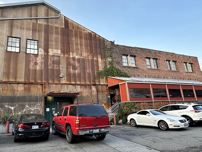 The unassuming industrial exterior of Bestia is LA's greatest culinary misdirection—like finding a Michelin star in a mechanic's garage.