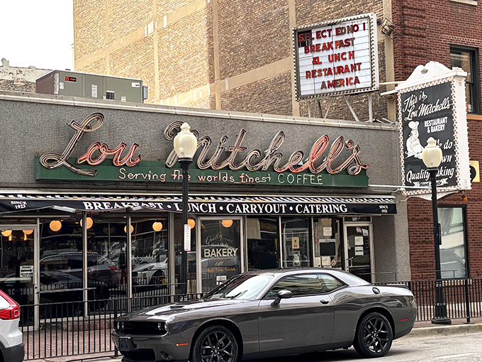 The neon sign at Lou Mitchell's doesn't just glow—it beckons like an old friend promising comfort in the form of perfectly scrambled eggs and bottomless coffee.