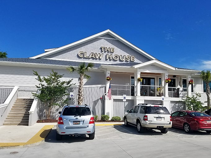 The white clapboard exterior of The Claw House stands like a beacon of seafood salvation against the Carolina blue sky, promising delicious treasures within.