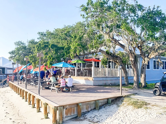 Paradise found: Aunt Kate's waterfront deck invites you to kick back under colorful umbrellas while the Tolomato River whispers sweet nothings to your appetite.