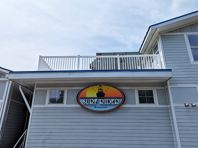 The iconic Surf Rider sign promises seafood paradise – like a coastal lighthouse guiding hungry travelers home.