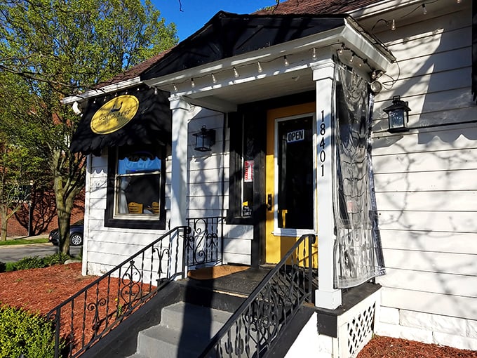 Home is where the pasta is! Molto Bene's charming converted house exterior with sunny yellow awnings promises Italian comfort in suburban Lakewood.