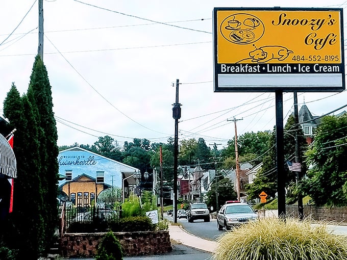 The bright yellow sign beckons like a culinary lighthouse on Main Street, promising the holy trinity of small-town comfort: breakfast, lunch, and that all-important ice cream finale.