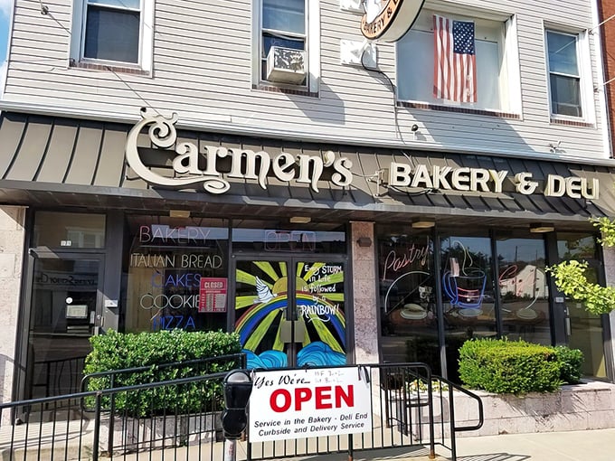 The storefront that launched a thousand cravings. Carmen's elegant signage and classic American flag promise authentic Italian-American delights within these Hazleton walls.
