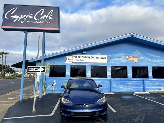 The bright blue beacon of breakfast bliss stands proudly along PCH, promising "the best breakfast in town" – a bold claim that generations of Newport locals will happily defend.