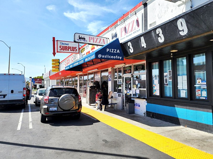 The unassuming storefront that houses pizza greatness. Like finding a Broadway star performing in your local coffee shop—unexpected but absolutely magical.