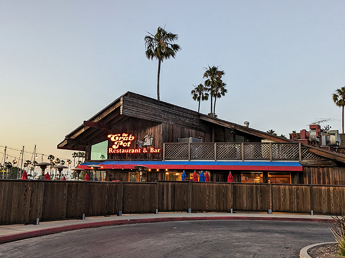 The quintessential California seafood joint: weathered wood, swaying palms, and a neon sign promising treasures from the sea. Paradise found.