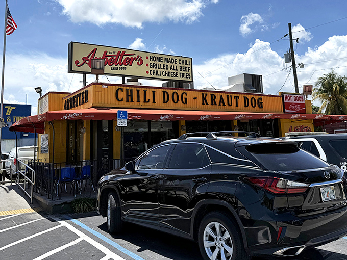 That bright yellow facade isn't just a building—it's a beacon of hope for the hungry. The Jesus Perez Patio beckons with the promise of chili dog nirvana.