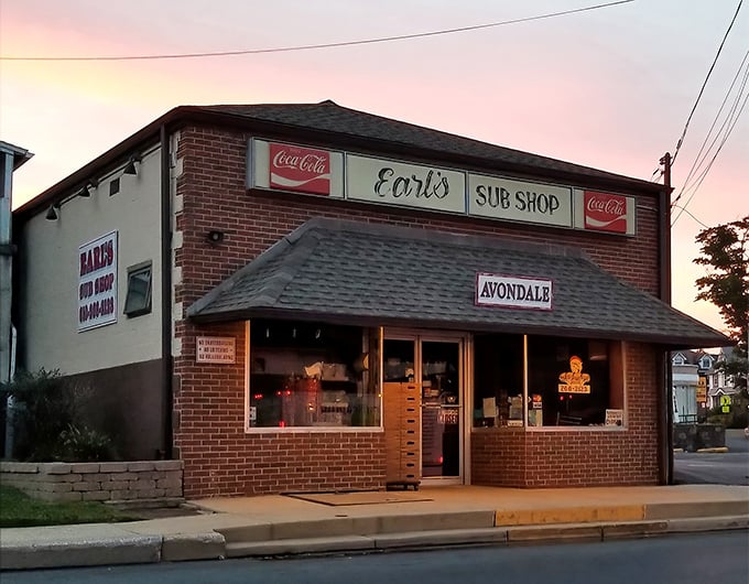 The sunset glow on Earl's brick facade isn't just pretty lighting—it's nature's way of highlighting where sandwich magic happens in Avondale.