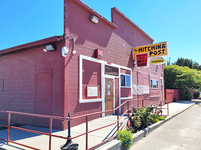 The iconic red exterior of the Hitching Post stands like a time capsule in Casmalia, celebrating over 70 years of carnivorous excellence.