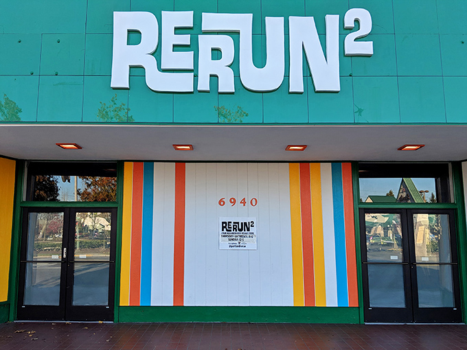 RERUN's vibrant green facade with rainbow stripes isn't just eye-catching—it's a preview of the technicolor treasure hunt waiting inside. Portland's vintage paradise beckons!
