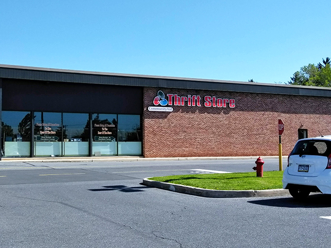The unassuming brick exterior hides a wonderland of secondhand treasures – like finding Narnia in a strip mall.