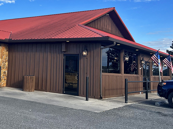 The rustic wooden exterior with its signature red roof isn't trying to impress anyone—until you taste what's happening inside. Florida barbecue with purpose.