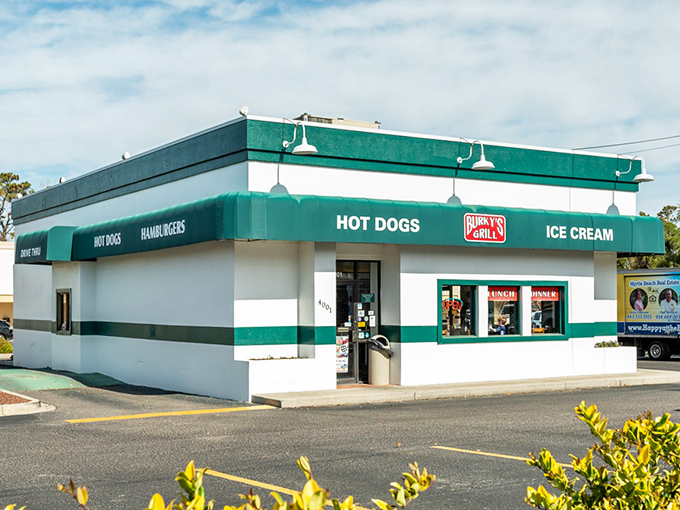The green and white exterior of Burky's Grill stands like a beacon of hope for hungry travelers seeking honest-to-goodness comfort food in Myrtle Beach.