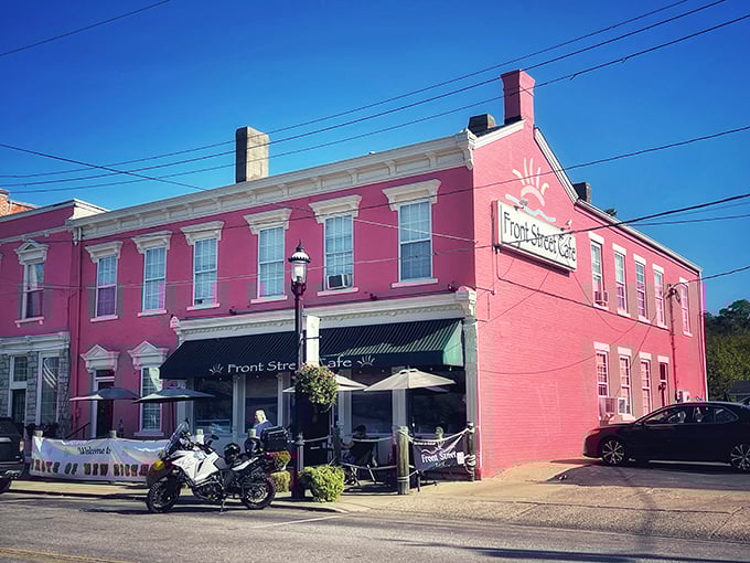The pink landmark that promises culinary delight! Front Street Café's vibrant exterior stands proudly along the Ohio River, beckoning hungry travelers with unmistakable charm.