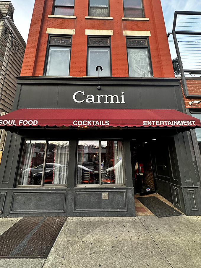The iconic red brick exterior of Carmi Soul Food stands like a beacon of Southern comfort in Pittsburgh's urban landscape. Soul food salvation awaits inside.