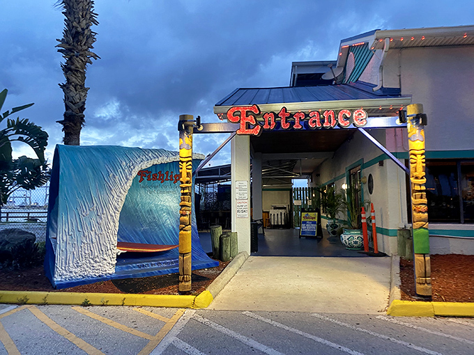 Welcome to paradise, where the entrance promises seafood adventures and the palm trees whisper "you're on vacation now."