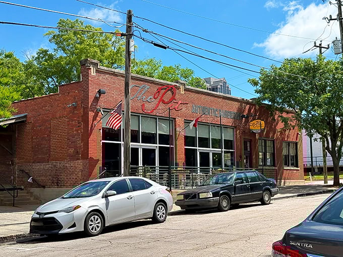 The brick exterior of The Pit stands like a temple to smoked meat, its unassuming façade hiding flavor explosions waiting to happen inside.
