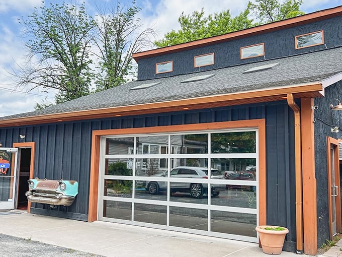 The blue exterior with vintage car trim isn't just eye-catching—it's a smoke signal to BBQ pilgrims that they've reached the promised land of pork.