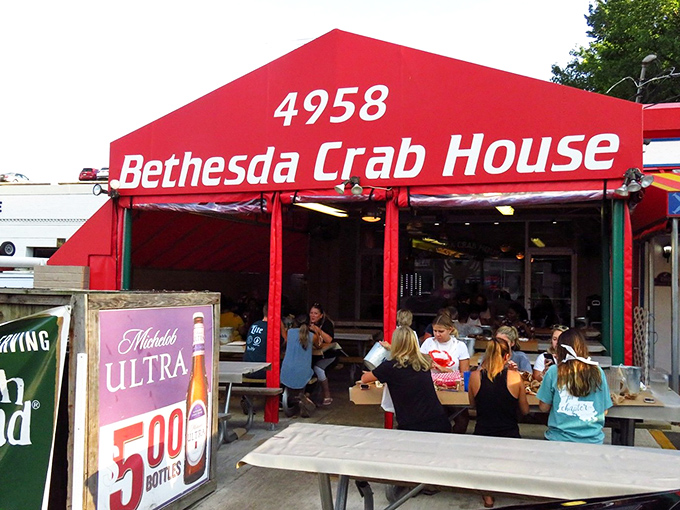 The iconic red awning of Bethesda Crab House stands as a beacon for crab lovers—no fancy frills, just the promise of seafood paradise within.