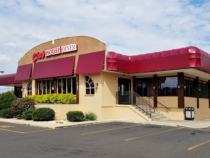 The iconic red awnings of Club House Diner beckon like a culinary lighthouse, promising comfort and satisfaction to hungry Bensalem travelers.