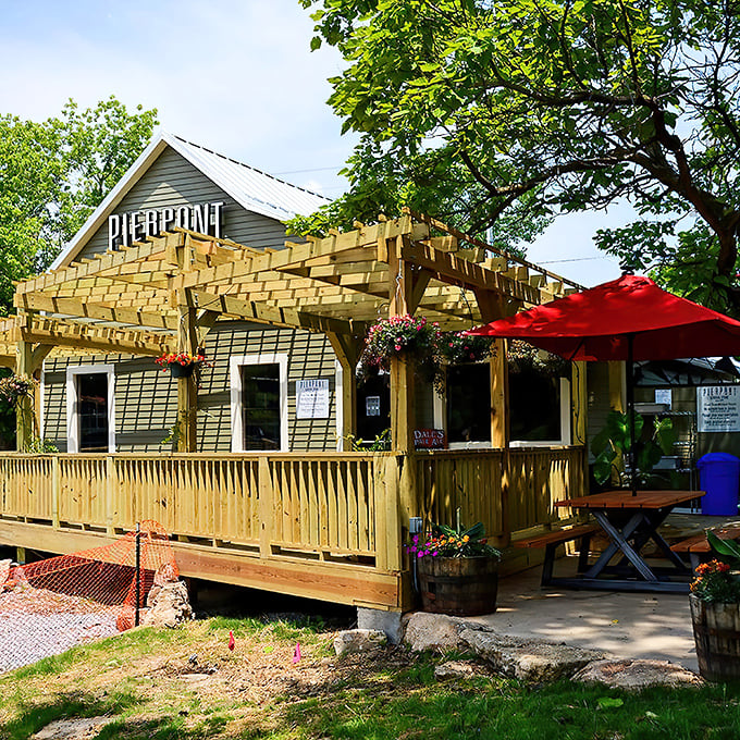 The wooden pergola and hanging flower baskets aren't trying to impress anyone—they're just being their authentic, charming Missouri self. Pure roadside magic.