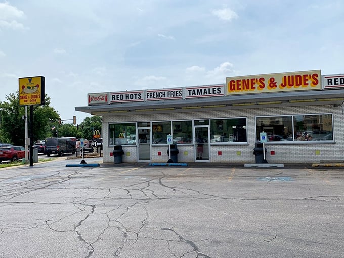 The white brick time machine on River Road beckons with its no-nonsense signage. RED HOTS, FRENCH FRIES, TAMALES—everything you need, nothing you don't.