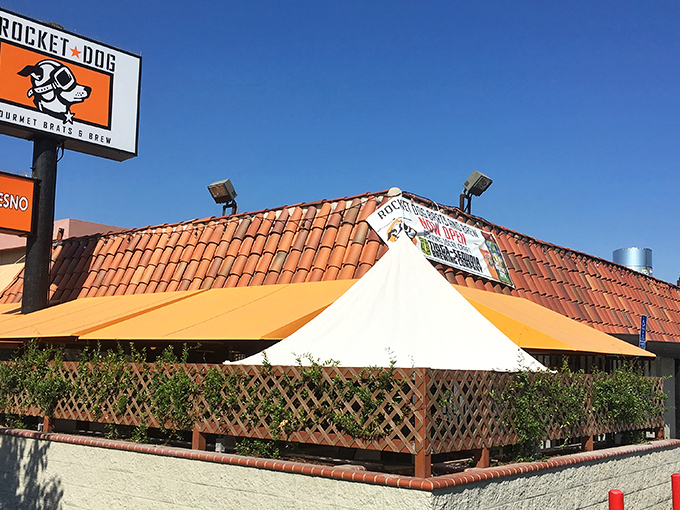 That orange and black sign isn't subtle, but neither is the flavor explosion waiting inside this Fresno favorite.