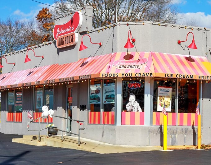 The pink and white striped awning of Johnnie's beckons like a carnival of comfort food, promising simple pleasures that transcend culinary trends.