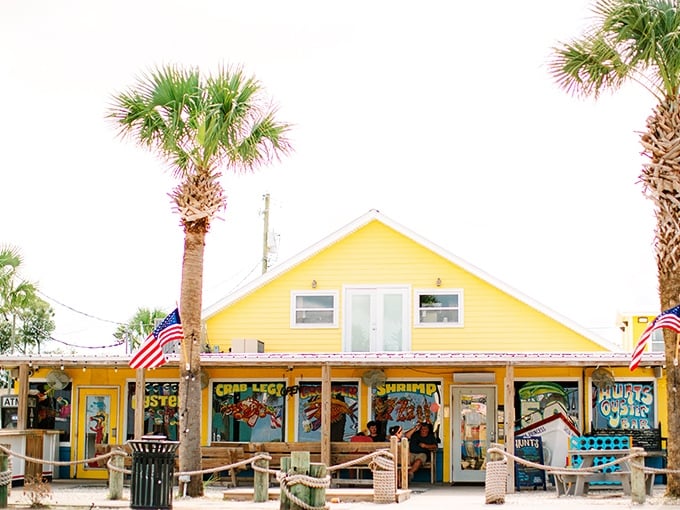 The bright yellow exterior of Hunt's with its boat hull "MISS ADLEY" out front isn't just eye-catching—it's practically shouting "fresh seafood ahead!" at passing motorists.