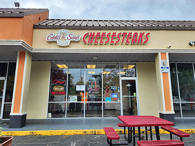 The storefront beckons like a lighthouse for hungry souls, with that bold red "CHEESESTEAKS" sign promising delicious salvation in Jacksonville's Southpoint Plaza.