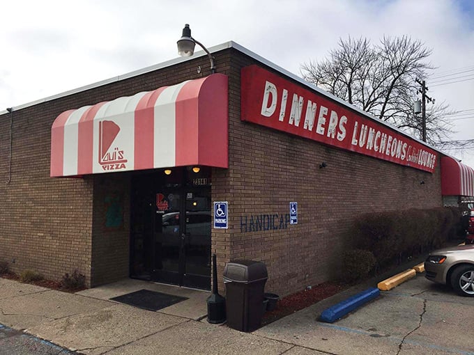 The unassuming exterior of Loui's Pizza proves once again that culinary treasures often hide in plain sight. Michigan's pizza pilgrims know: it's what's inside that counts.
