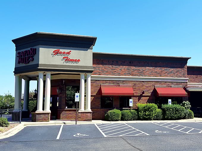 Safari Miles welcomes hungry travelers with its stately brick façade and classic columns, like a culinary embassy where your passport to prime rib awaits.