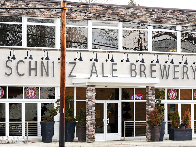 Stone-faced elegance meets German brewing tradition at Schnitz Ale Brewery's exterior. The modern signage promises what awaits inside—a perfect marriage of craft and comfort.