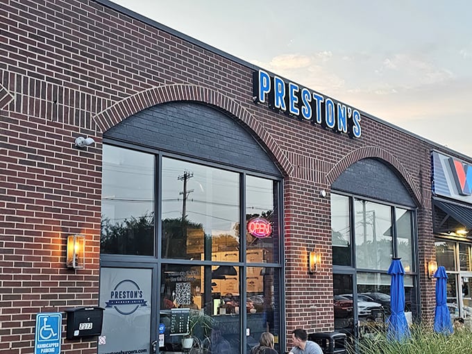 Preston's brick exterior says "no frills" but the glowing blue sign promises something special waiting inside for burger enthusiasts.