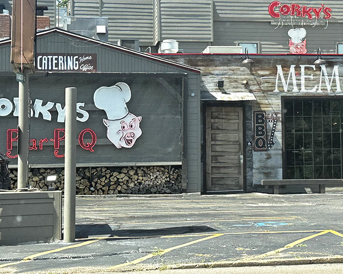That iconic neon pig sign isn't just calling you in—it's promising a religious experience. The stacked hickory wood below isn't decoration; it's the secret weapon.