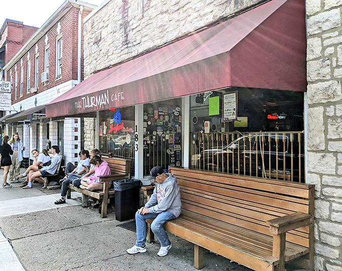 The iconic burgundy awning of The Thurman Cafe welcomes hungry pilgrims to this Columbus institution where waiting outside is part of the experience.