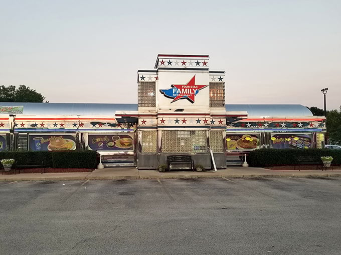The patriotic facade of Four Star Family Restaurant gleams like a beacon for hungry travelers, promising all-American comfort in the heart of Mt. Zion.