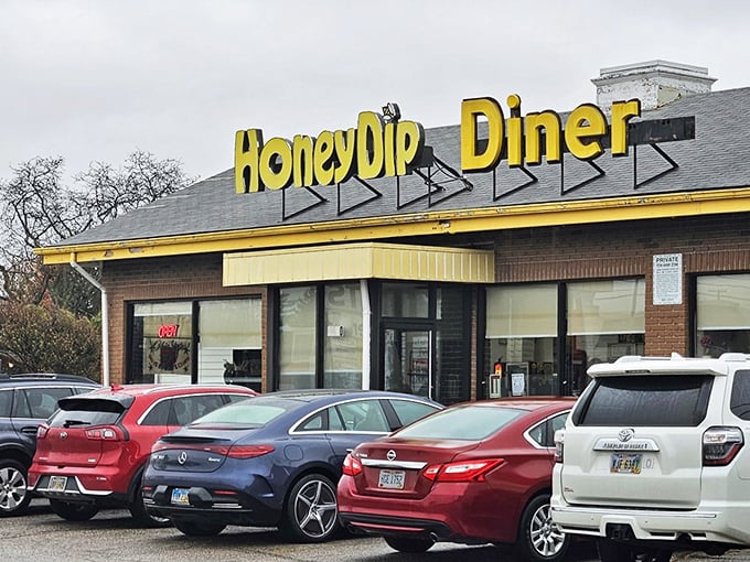 The bright yellow sign of HoneyDip Donuts & Diner stands as a beacon of breakfast hope in Columbus, promising sweet salvation to donut pilgrims.
